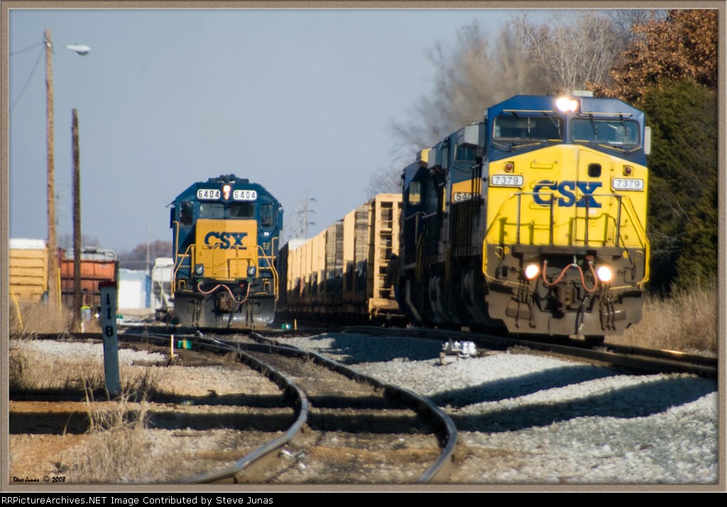 CSX 7379,5401,7604 moves back toward its train after working the yard